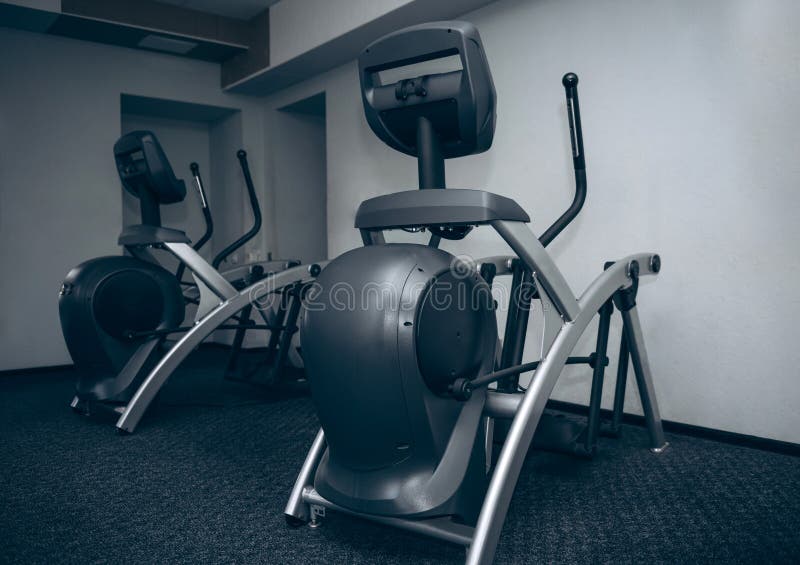 Elliptical Cross Trainer in the Gym Stock Photo - Image of room ...