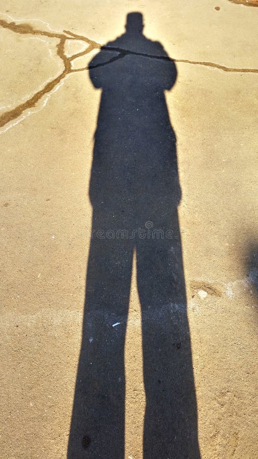 Elongated male shadow stock image. Image of adult, human - 87623117