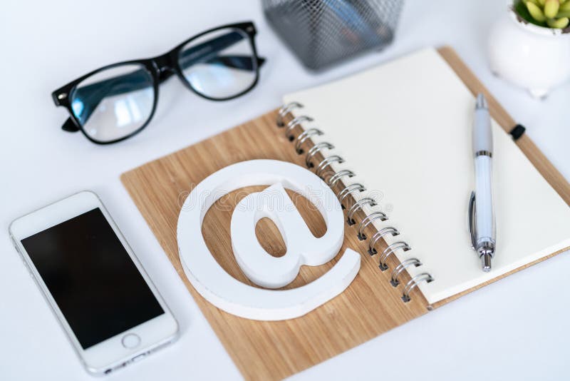 Email Comcept. Contact Us for Feedback. Desktop with Notepad ...