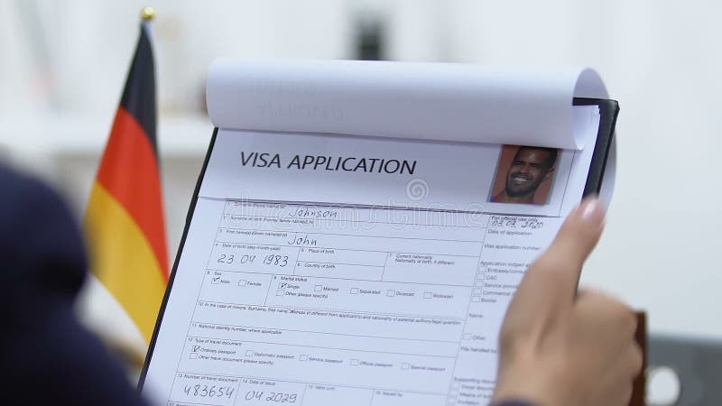 Embassy Manager Checking German Visa Application, Marking Approved ...