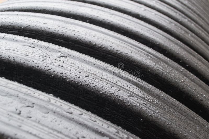 Embossed Large Pipe Outside in the Rain. Water Droplets on the Surface ...