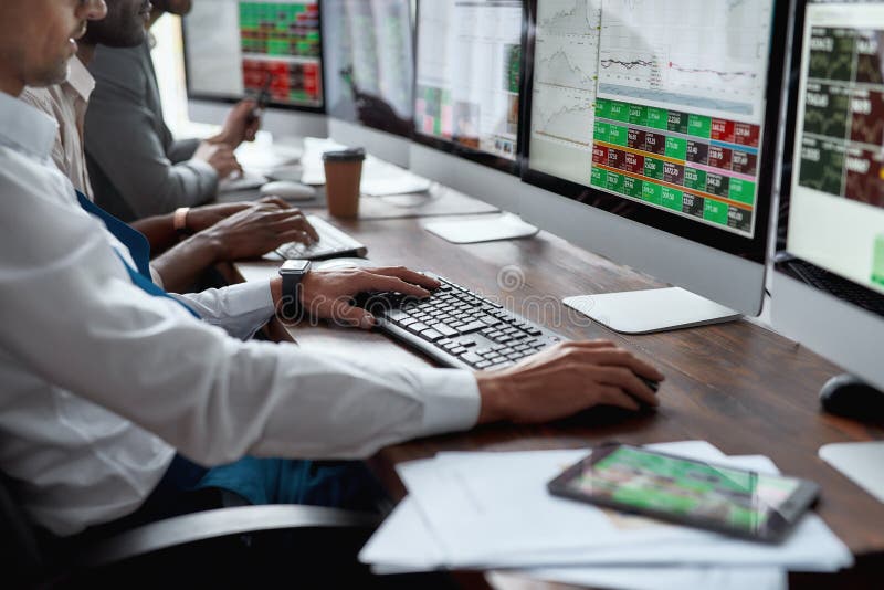 Embracing Ingenuity. Cropped Shot of Three Businessmen Sitting at ...