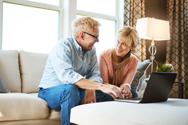 Embracing Technology with Ease. a Mature Couple Using a Laptop Together ...