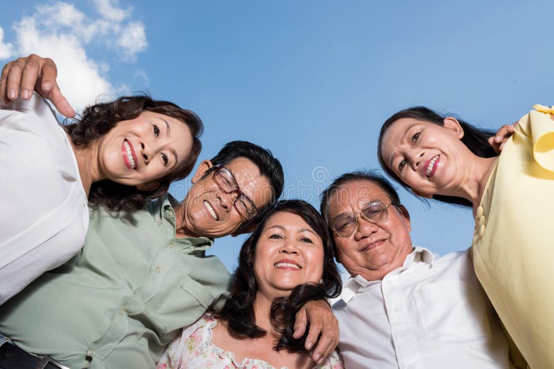 Embracing Vietnamese Friends Stock Image - Image of friend, mature ...