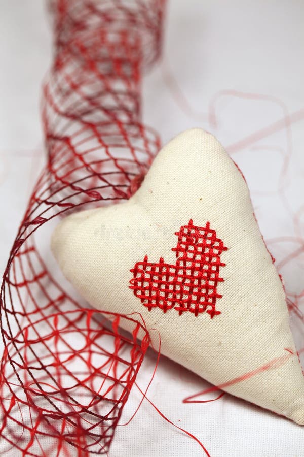 Embroidered Heart and Ribbon Stock Photo - Image of gift, cross: 12126986