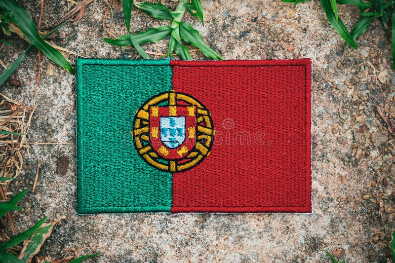 Eco Friendly Embroidered Portuguese Flag on Old Stone with Natural Foliage. Stock Image - Image ...