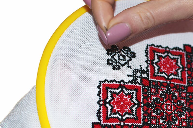 Embroidering a Cross on a White Fabric with Red and Stock Image - Image ...