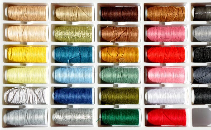 Embroidery yarn bobbins stock image. Image of green, silver - 32556595