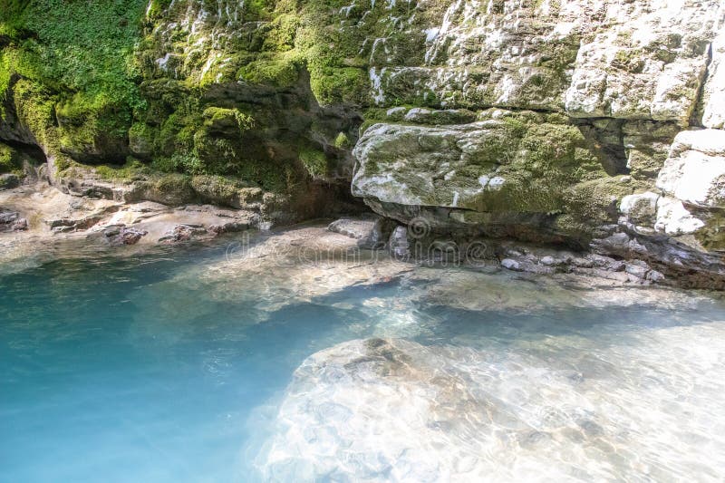 Emerald Turquoise Water Pool in Limestone Cave Canyon with Moss Walls ...