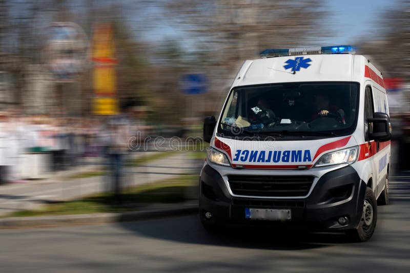 Urgent Response Ambulance in Motion, Front View with Flashing Blue ...