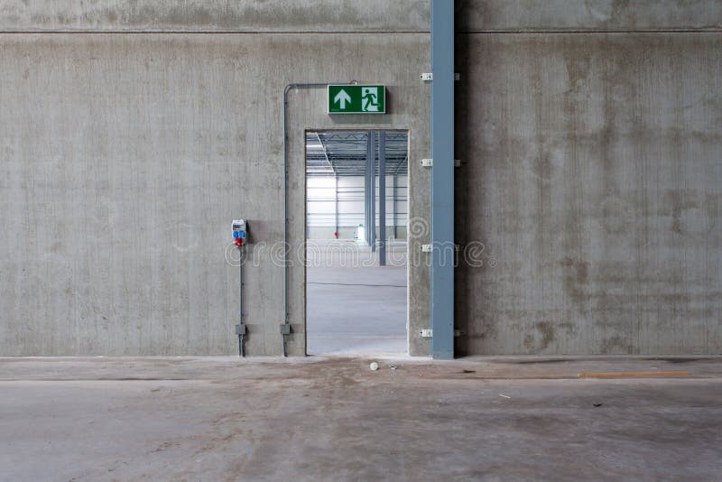Emergency Evacuation Assembly Point Sign on a Pole on a White ...