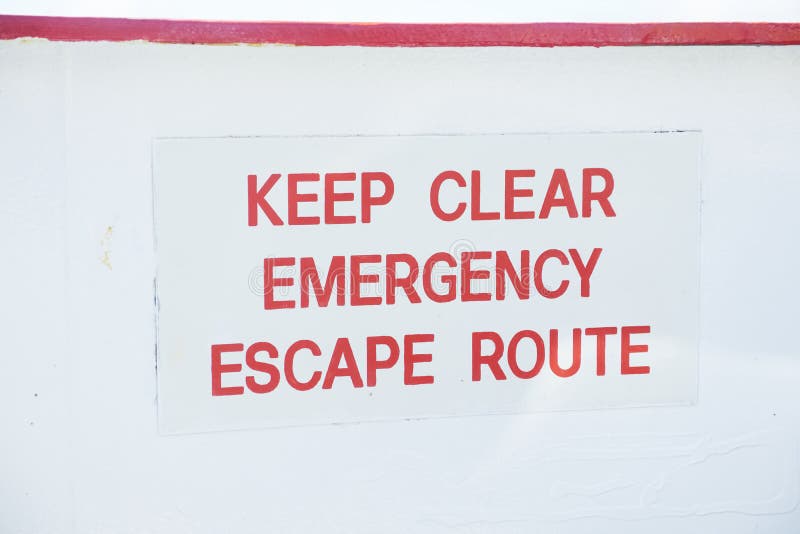 Emergency Escape Route Sign Stock Photo - Image of facade, colour ...