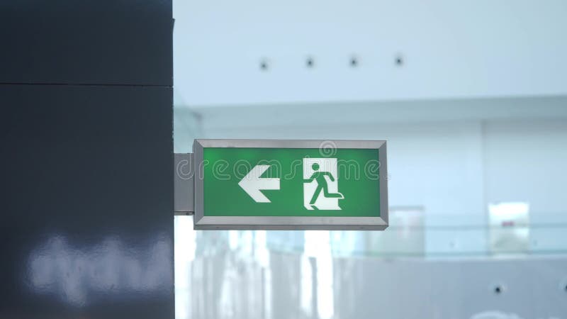 Emergency Exit Sign Pointing Right Above the Stairs Indoors Stock Video ...