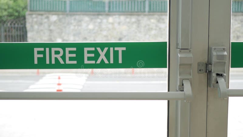 Emergency Exit Sign on a Door Inside of a Building Stock Video - Video ...