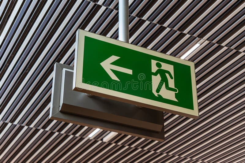 View on Emergency Exit Sign. with Running Figure and Arrow To the Left ...