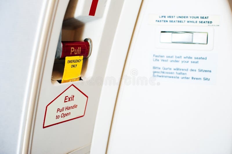 Emergency Exit on the Plane. Pull Handle To Open Stock Image - Image of ...
