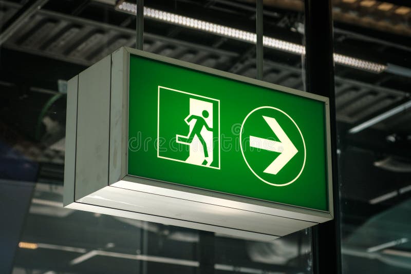 Emergency Exit Sign on Airport Closeup Stock Photo - Image of ...