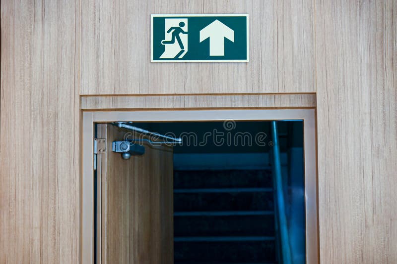 Emergency Exit Sign on the Door of a Hotel, Emergency Exit. Stock Image ...