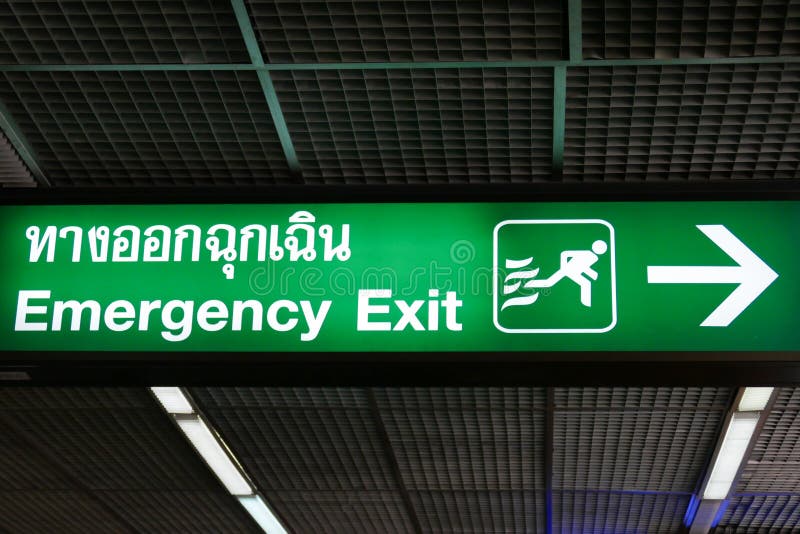Emergency Exit Sign in English and Thai Language Stock Photo - Image of ...