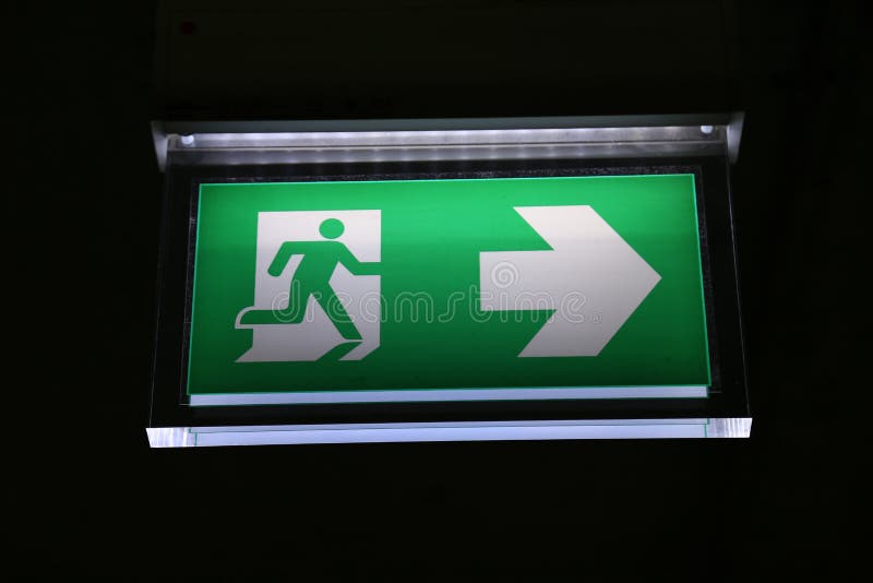 Emergency Exit Sign Glowing in the Dark Stock Image - Image of ...