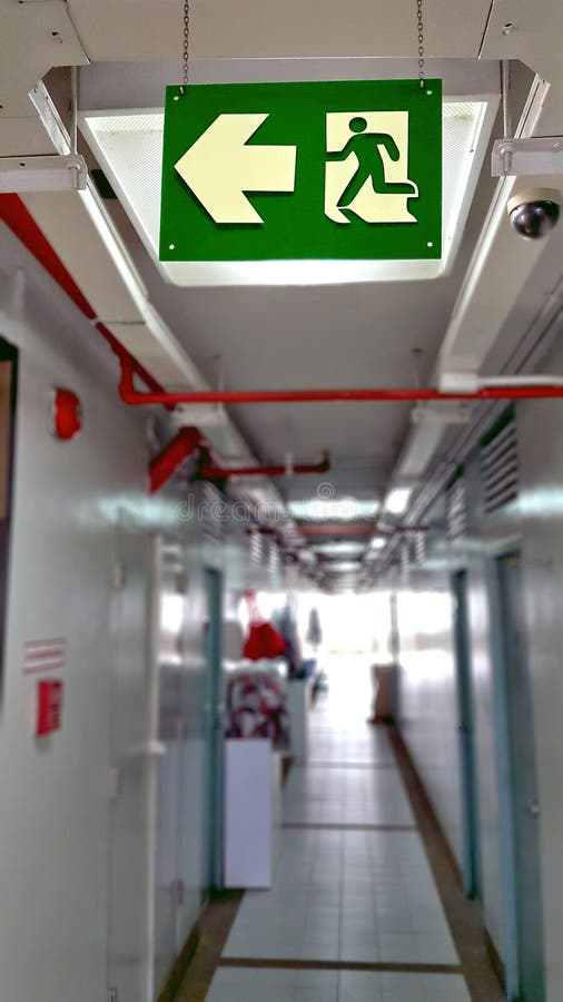 Emergency Exit Sign in Hallway of Apartment Stock Photo - Image of ...