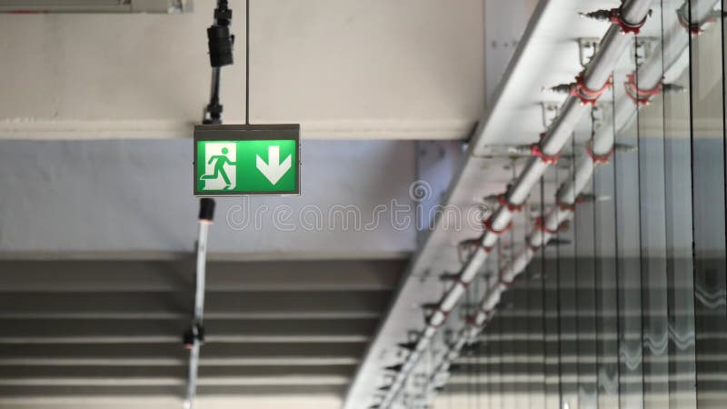 Emergency Exit Sign in a Modern Building Hallway Stock Footage - Video ...