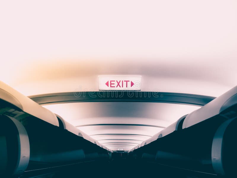 Emergency Exit Sign in Passenger Cabin of an Airplane. Stock Image ...