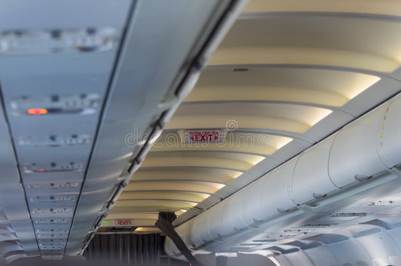 Emergency Exit Sign on a Passenger Plane Stock Photo - Image of ...