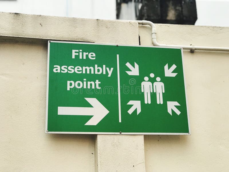 Emergency Exit Sign on the Wall of a Building. Keep Your Distance Stock ...