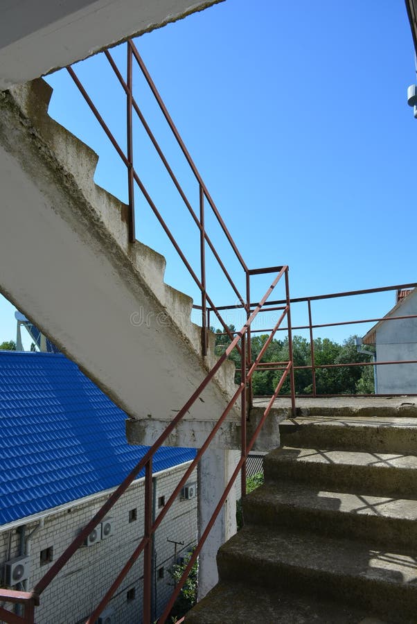 Emergency Fire Concrete Staircase with Metal Handrails in the Sunlight ...