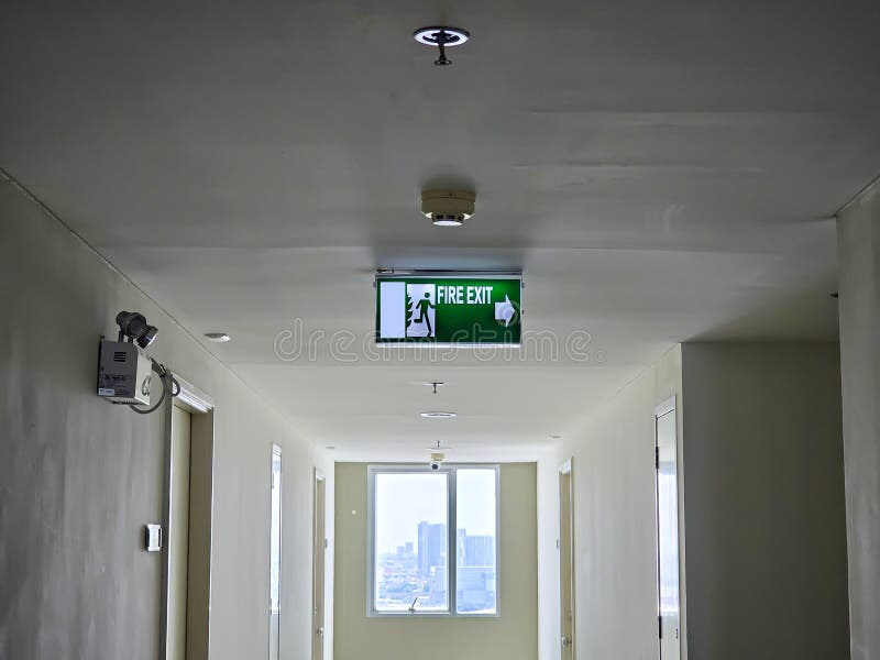 Emergency Fire Exit Sign in the Building Stock Image - Image of ...