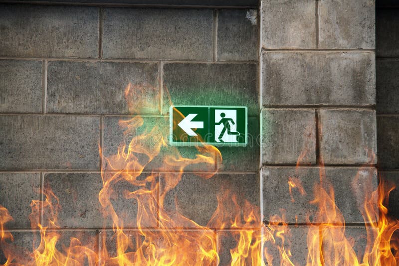Emergency Fire Exit on the Stone Wall with Fire Flames Stock Photo ...