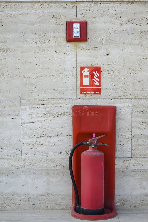 Emergency Fire Extinguisher Standing on the Wall Stock Photo - Image of ...