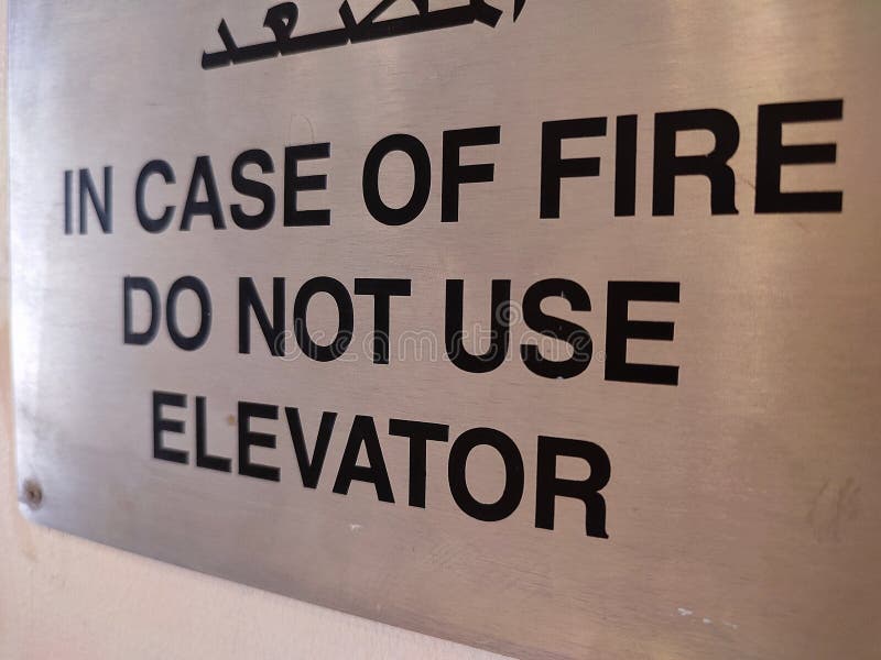 An Emergency Fire Signage in Case of Fire Do Not Use Elevator Letters ...