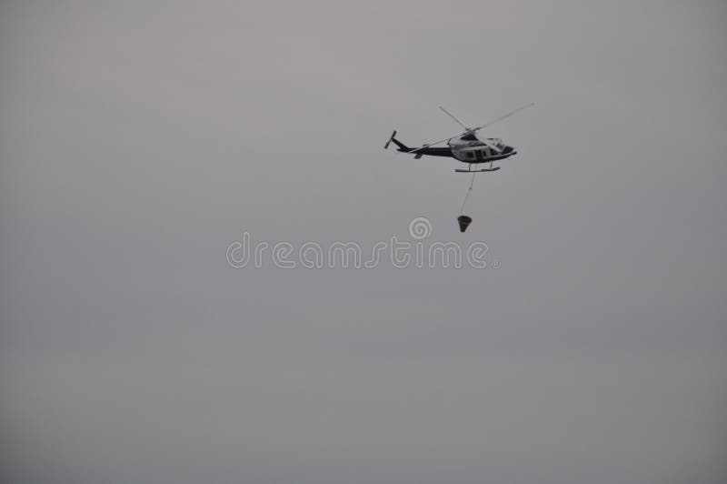 Helicopter Saving People in Flight Stock Photo - Image of plane ...