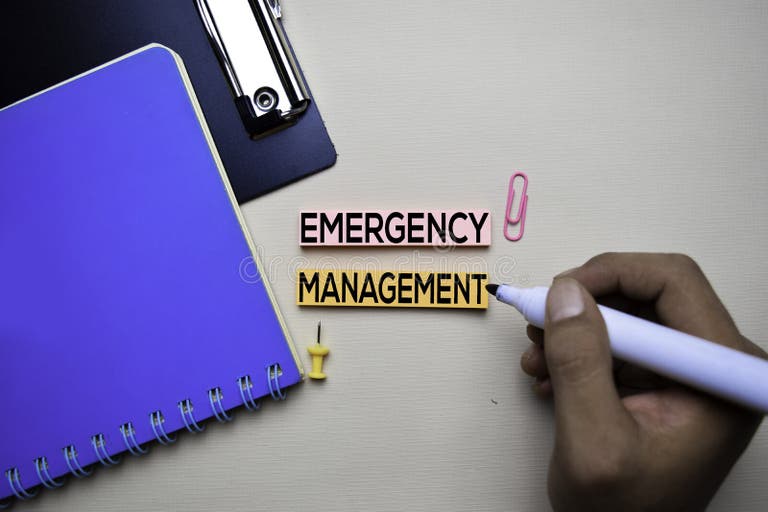 Emergency Management Text on Sticky Notes with Office Desk Concept ...
