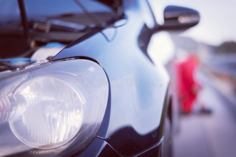 Emergency Roadside Assistance, Road Assistance Worker in Uniform Trying ...