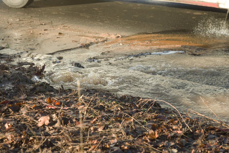 Emergency Sewerage. Water Flows Down the Sidewalk from a Ruptured ...