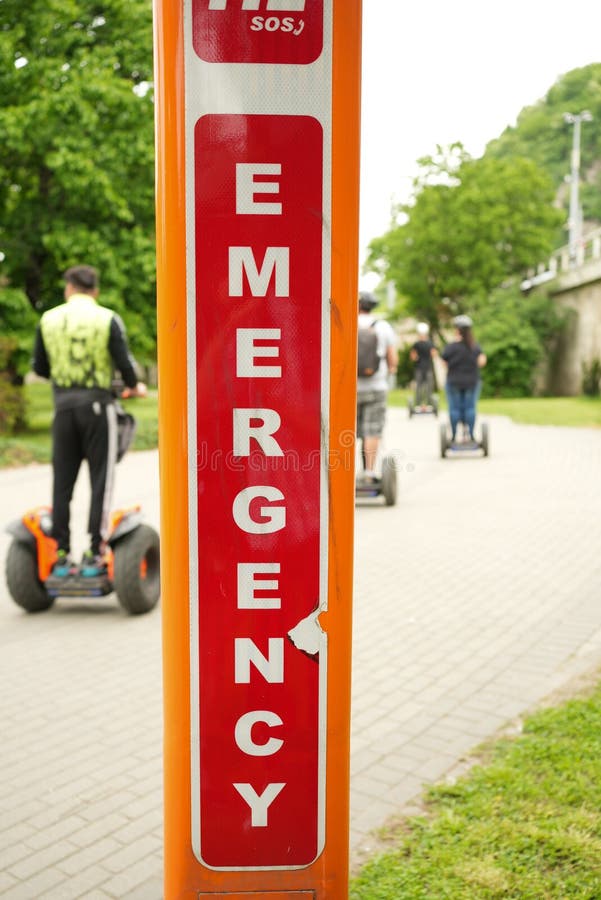 Emergency Sign and a Group of Segway Tourists Stock Image - Image of ...