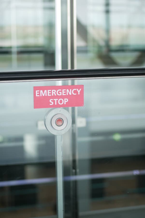 An Emergency Stop Button is Placed on a Glass Wall in a Public Space ...