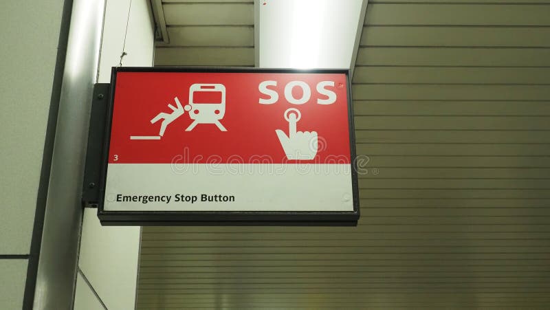 An Emergency Stop Button Sign in a Train Station and Providing SOS ...