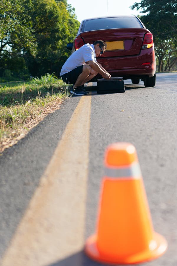 Emergency Stop Sign and Man with Broken Down Car on the Highway Stock ...