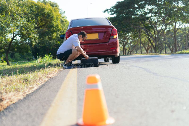 Emergency Stop Sign and Man with Broken Down Car on the Highway Stock ...