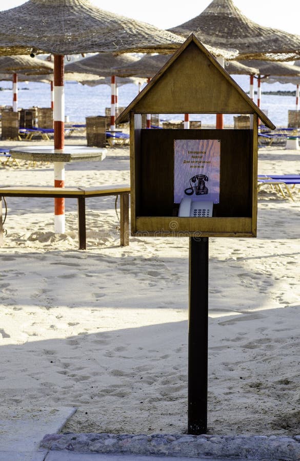 Emergency Telephone in a Wooden Booth on the Beach. Stock Image - Image ...
