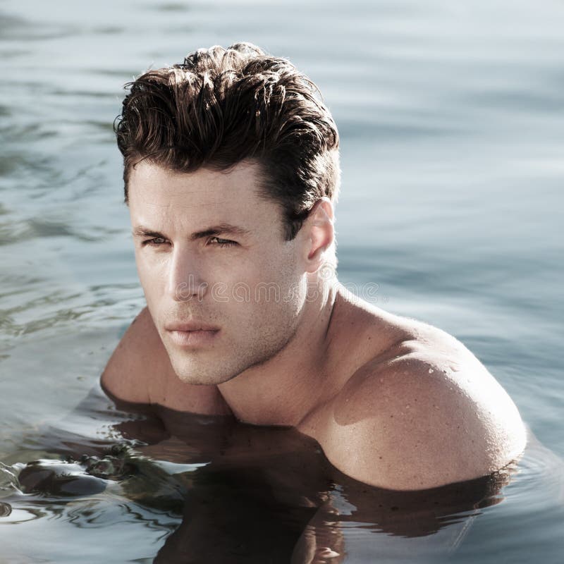Emerging from the Water. a Handsome Man Looking Contemplative Sitting ...