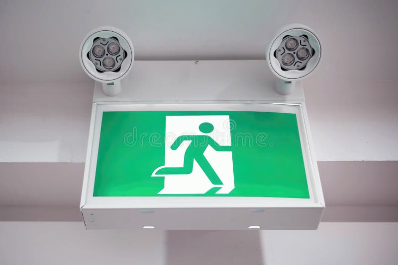 Emergency Exit Sign and Security Cameras Stock Image - Image of exit ...