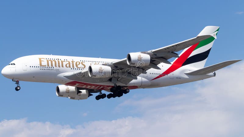Emirates Airlines Aircraft Soaring Against a Blue Sky Backdrop ...