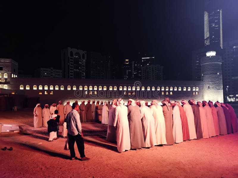 Emirati Men Perform a Tradional Middle Eastern Dance the Yowla ...