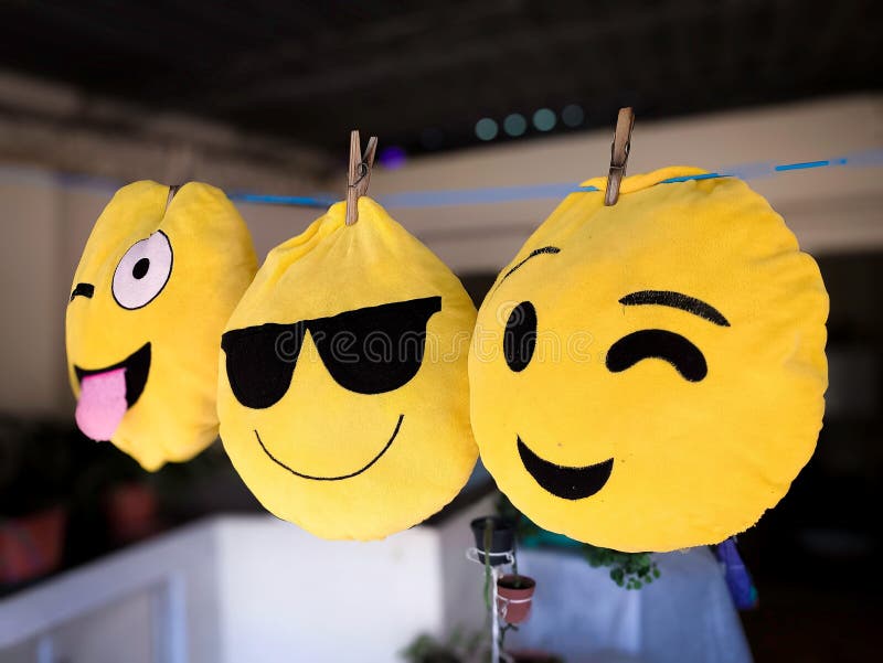 Emoji-shaped Pillows on the Clothesline Stock Photo - Image of ...