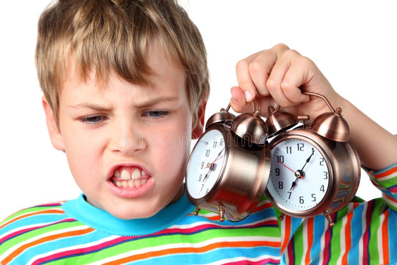 Emotional Boy Holds Two Alarms Stock Photo - Image of human, cute: 18360290